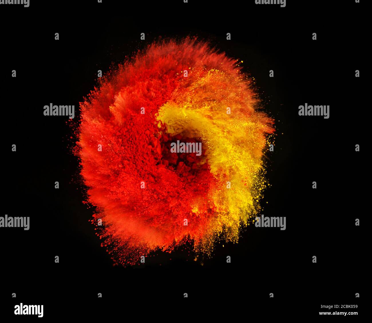 Coloured powder explosion isolated on black background Stock Photo - Alamy
