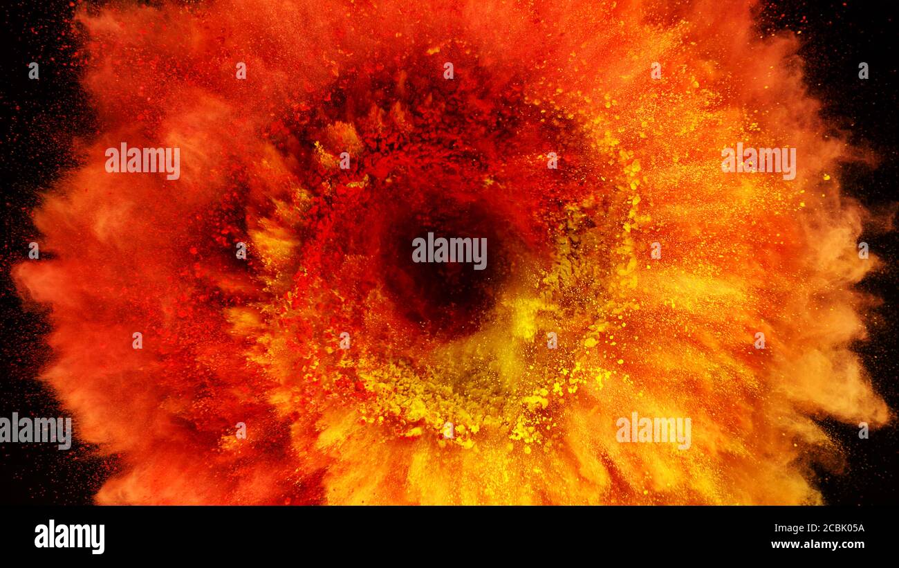 Coloured powder explosion isolated on black background Stock Photo - Alamy