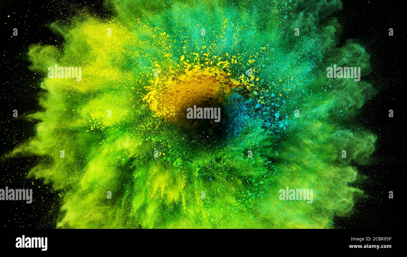 Coloured powder explosion isolated on black background Stock Photo - Alamy