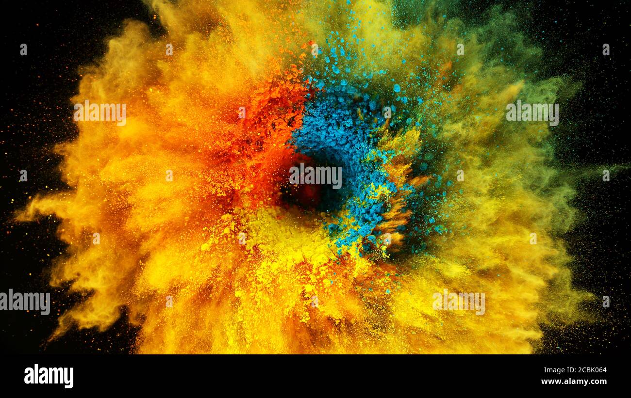 Coloured powder explosion isolated on black background Stock Photo - Alamy