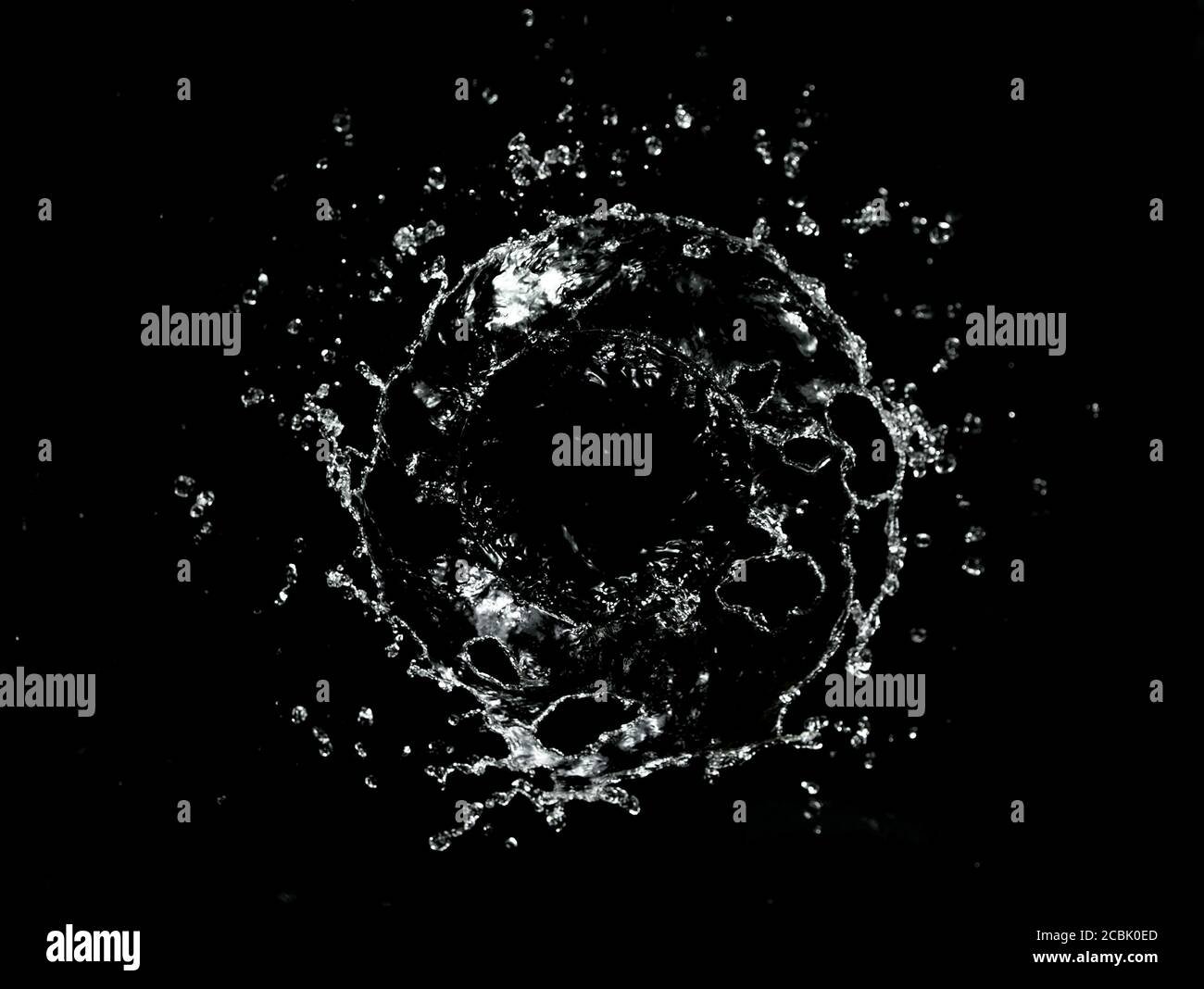 Abstract twister shape of water splash, isolated on black background ...