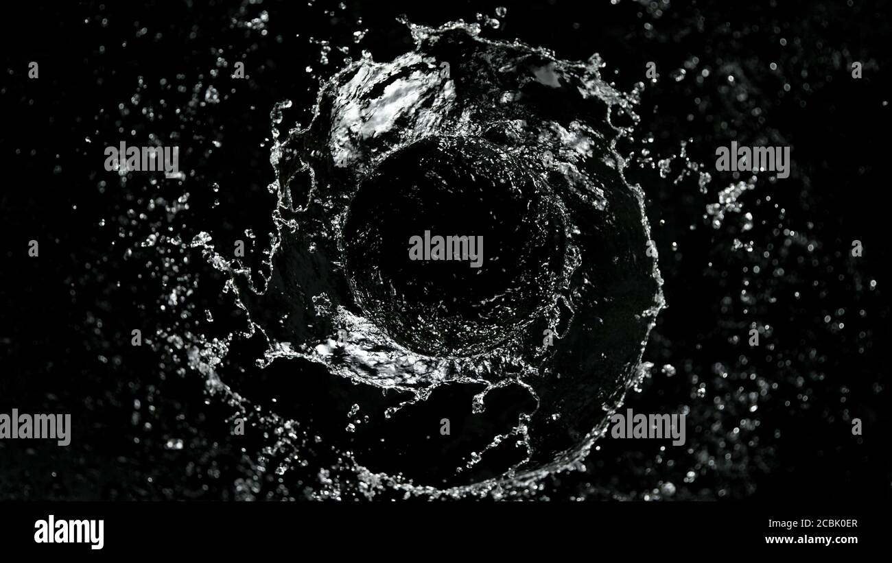 Abstract twister shape of water splash, isolated on black background ...