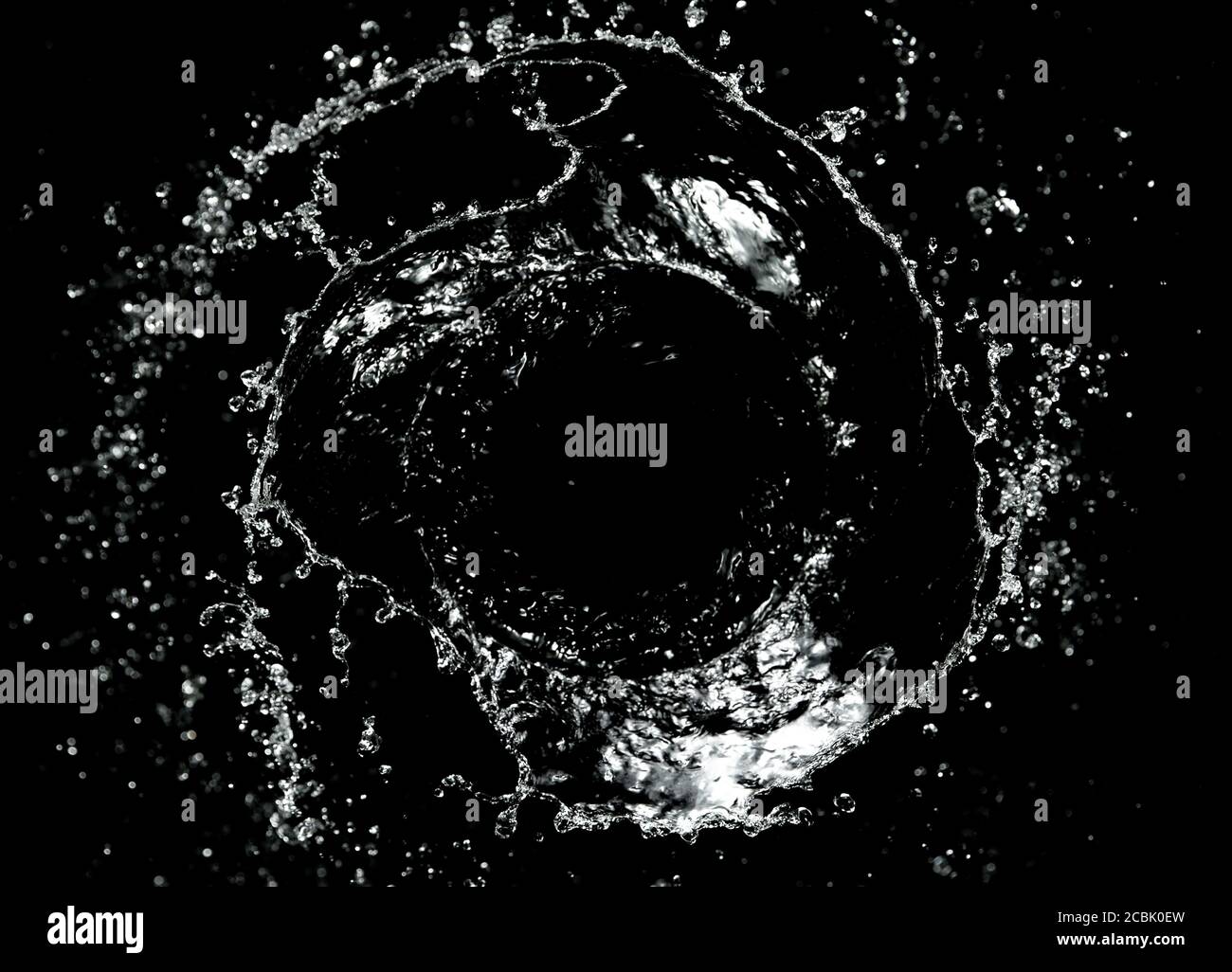 Abstract twister shape of water splash, isolated on black background ...