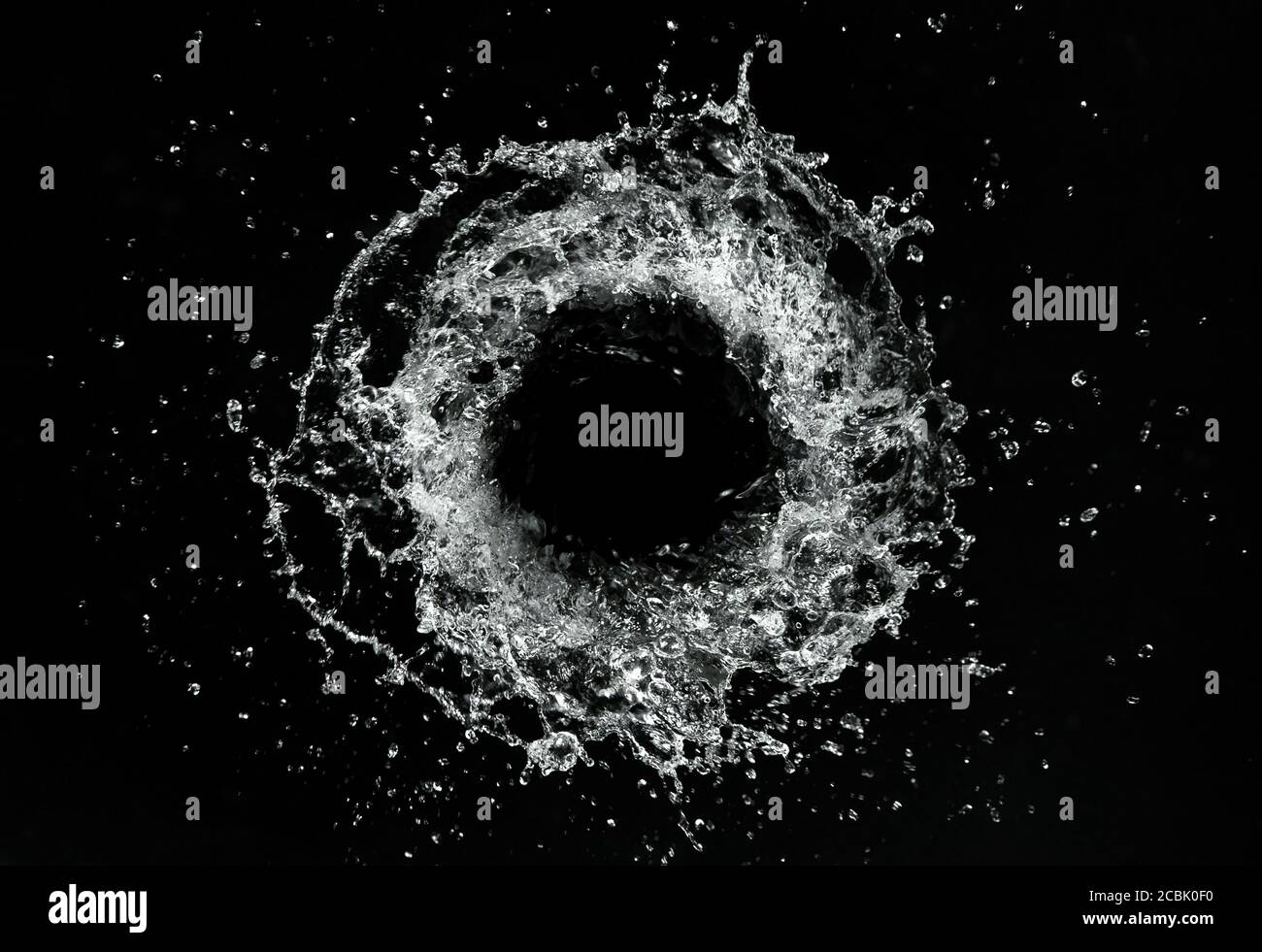 Abstract twister shape of water splash, isolated on black background ...