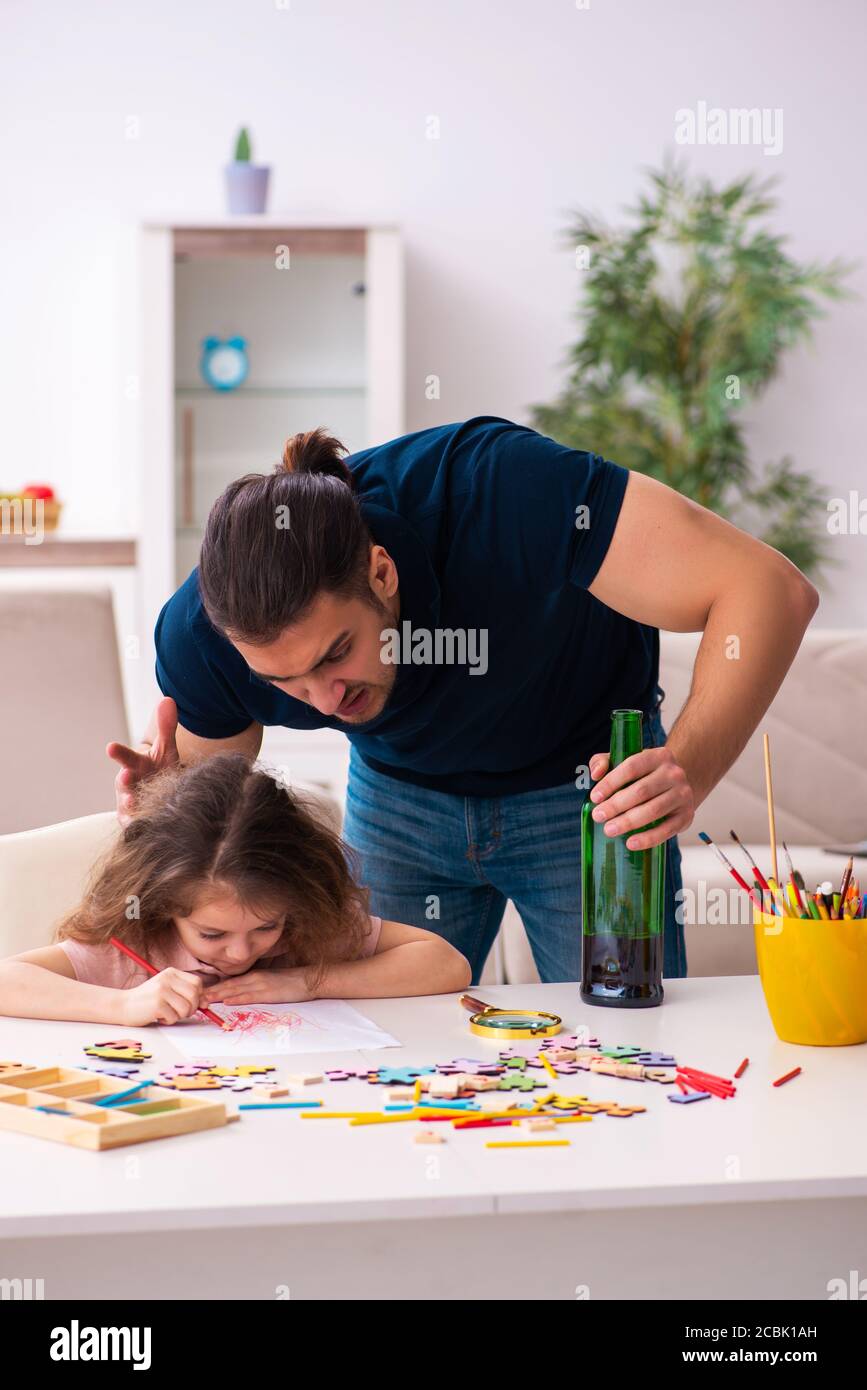 Drunk father and little girl at home Stock Photo - Alamy