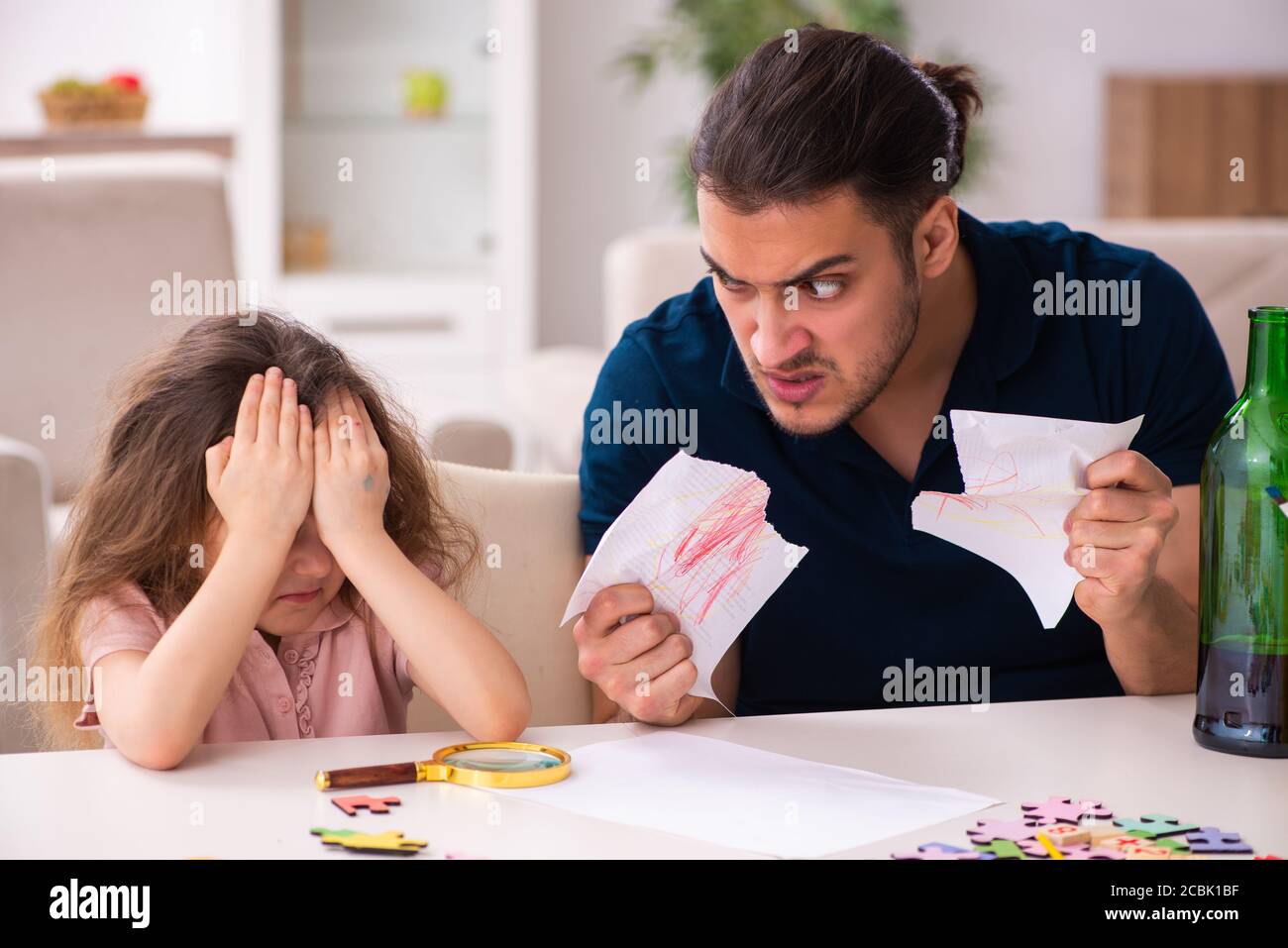 Drunk father and little girl at home Stock Photo - Alamy