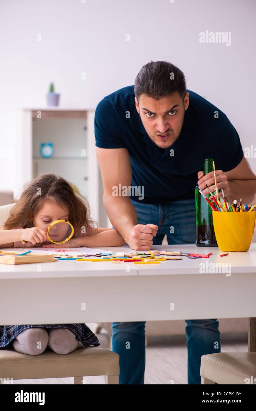 Drunk father and little girl at home Stock Photo - Alamy