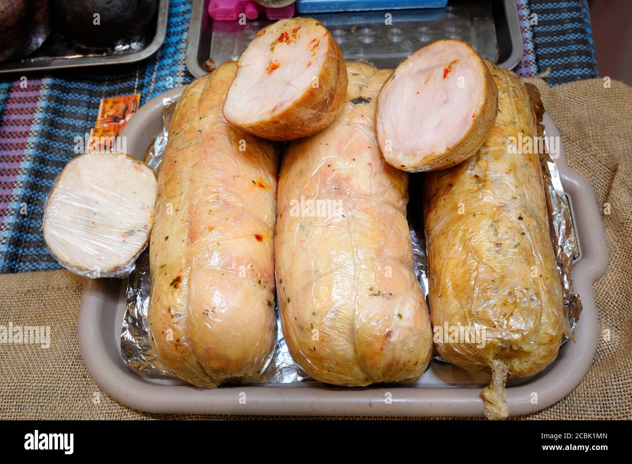 Sticks of meat paste placed on a counter Stock Photo - Alamy