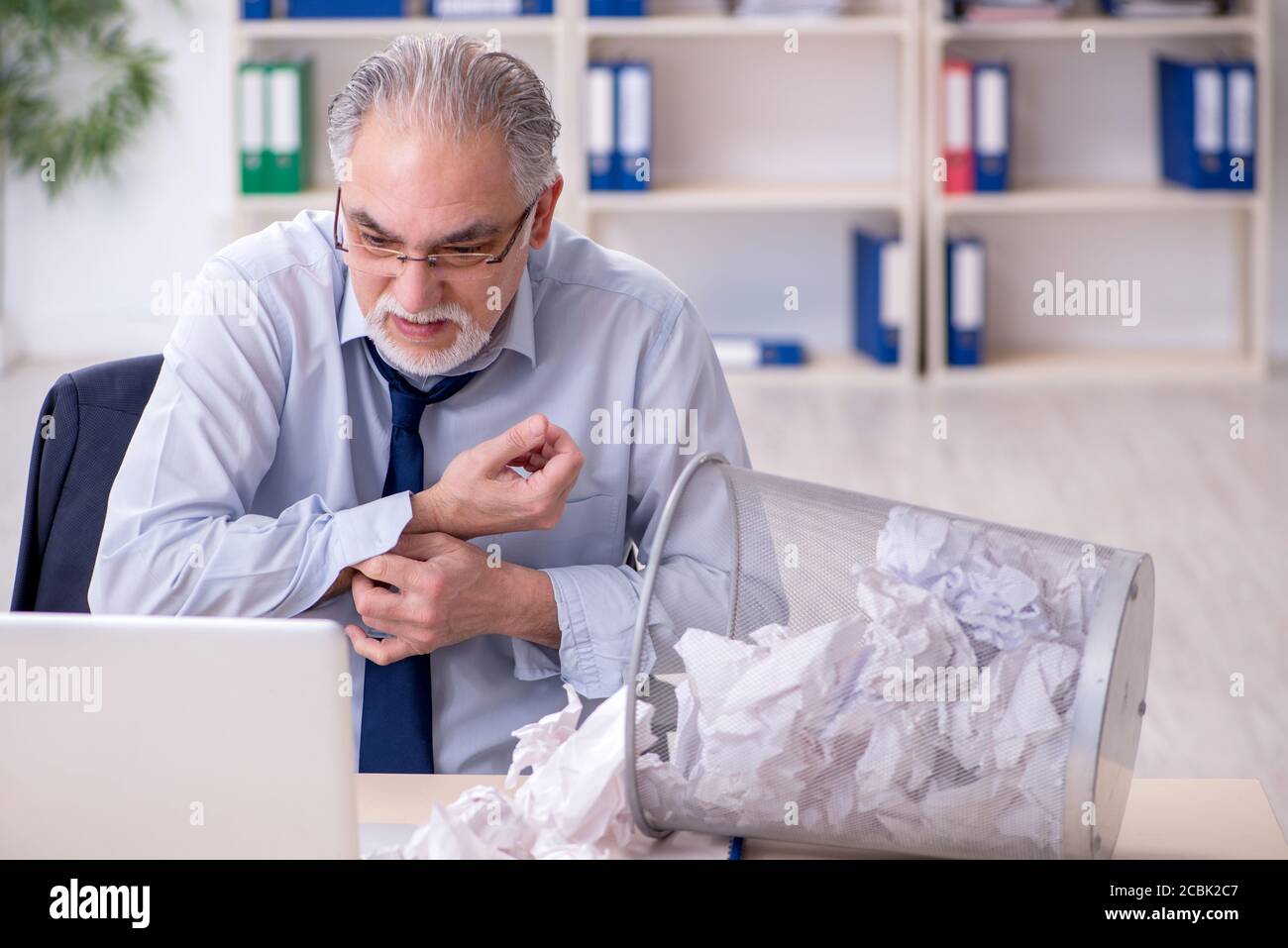 Old businessman rejecting ideas with lots of papers Stock Photo - Alamy