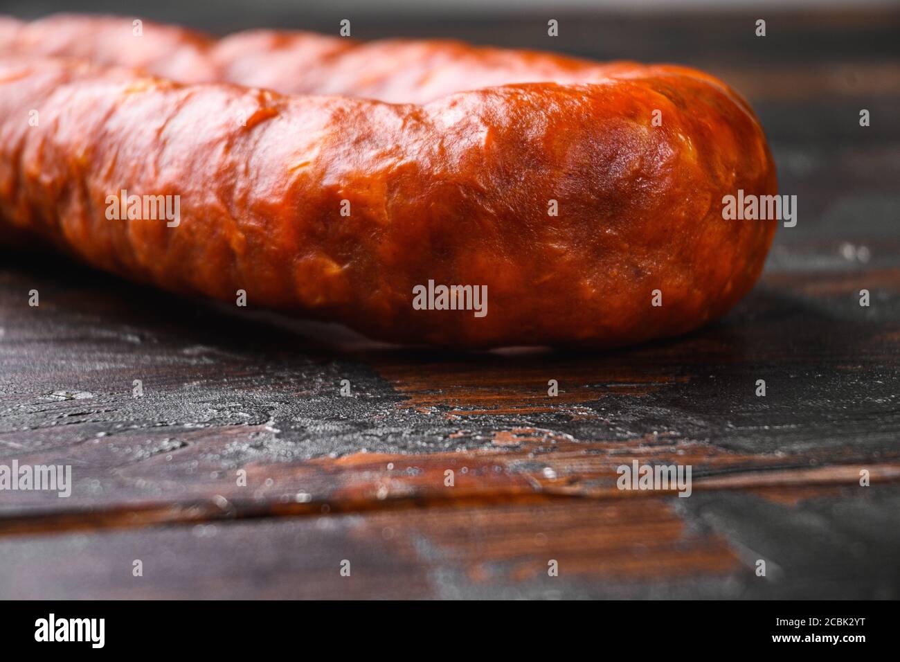 Traditional spanish chorizo sausage on wooden surface Stock Photo - Alamy
