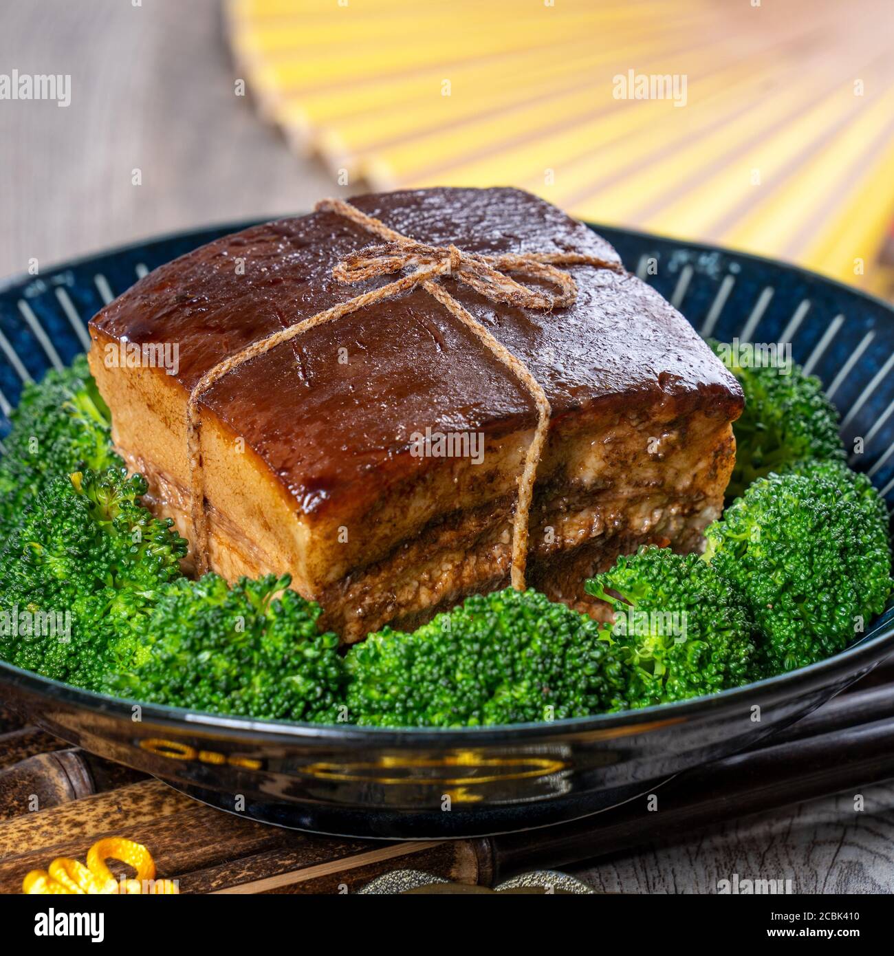 Dong Po Rou (Dongpo pork meat) in a beautiful blue plate with green ...