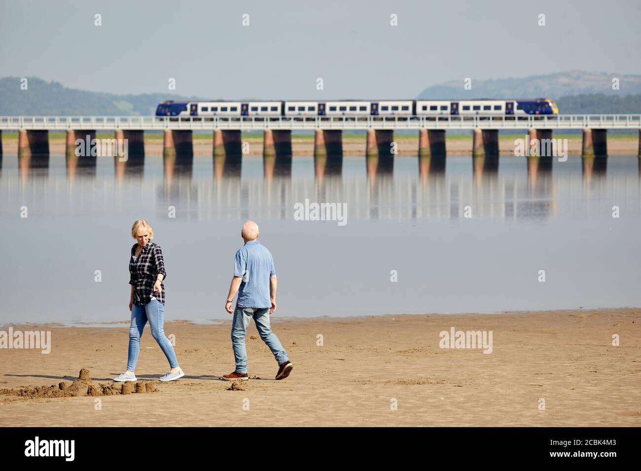 Arnside village Cumbria coastal beach Morecambe Bay, River Kent crossed ...