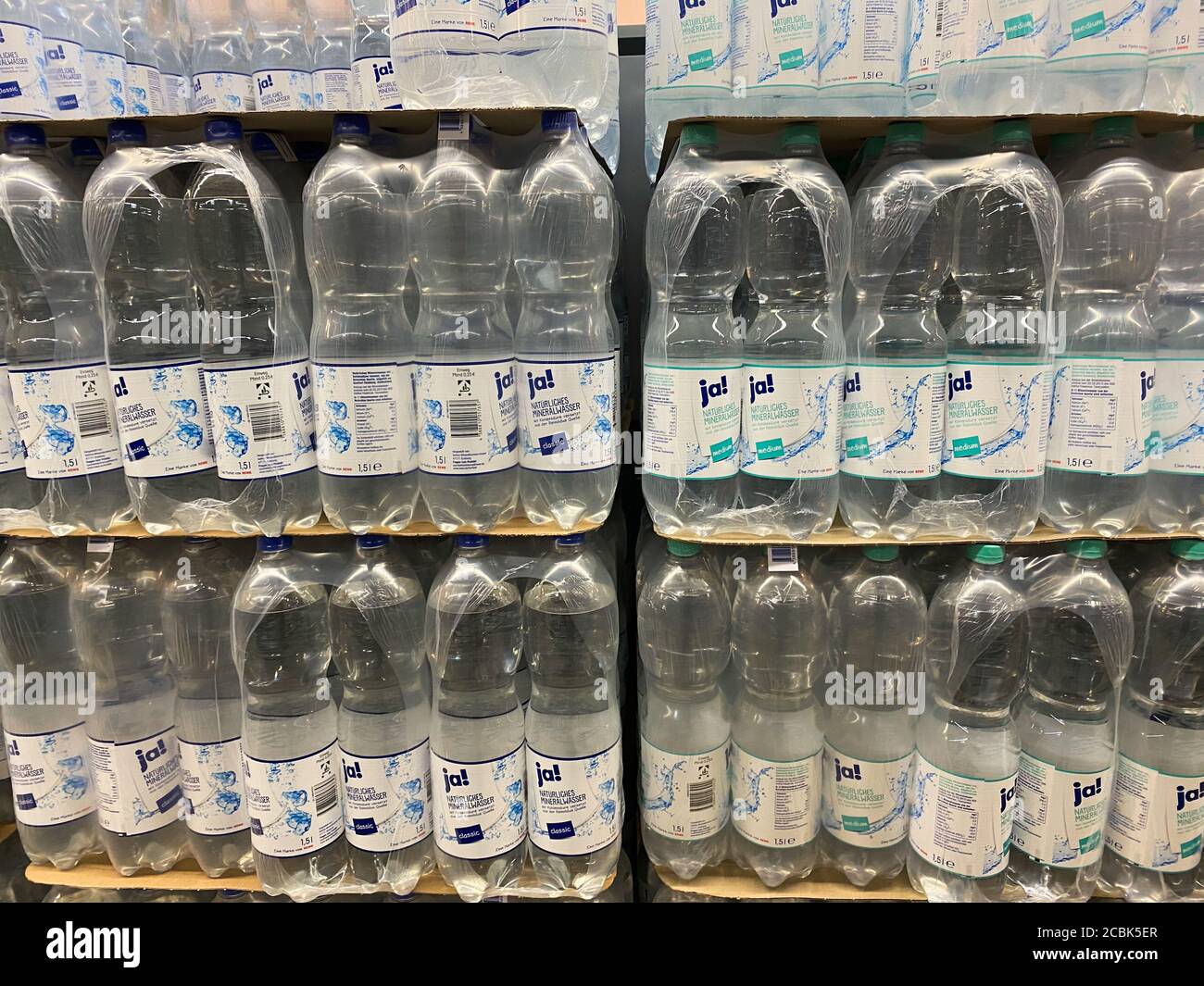 Viersen, Germany - July 9. 2020: View on wall of stacked plastic water ...