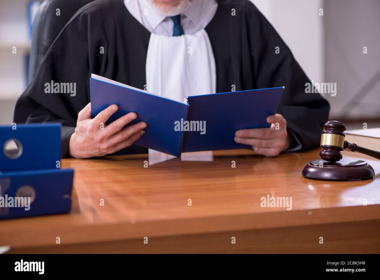 Old judge working in courthouse Stock Photo - Alamy