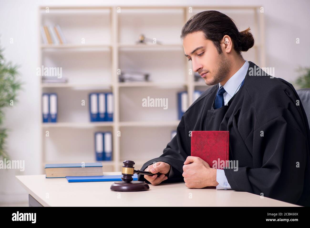 Young judge working in courthouse Stock Photo - Alamy