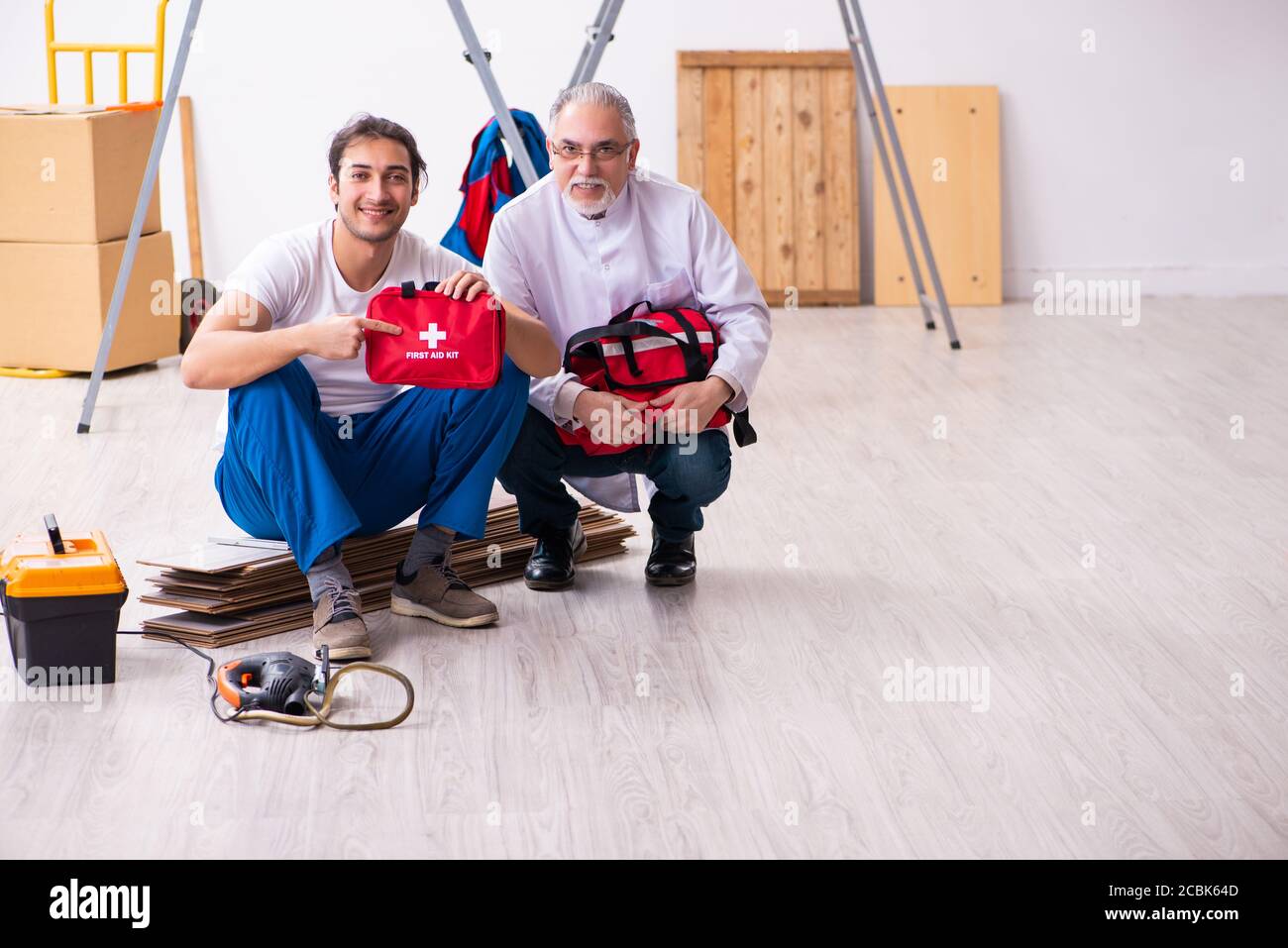 Experienced paramedic helping worker bitten by snake Stock Photo - Alamy