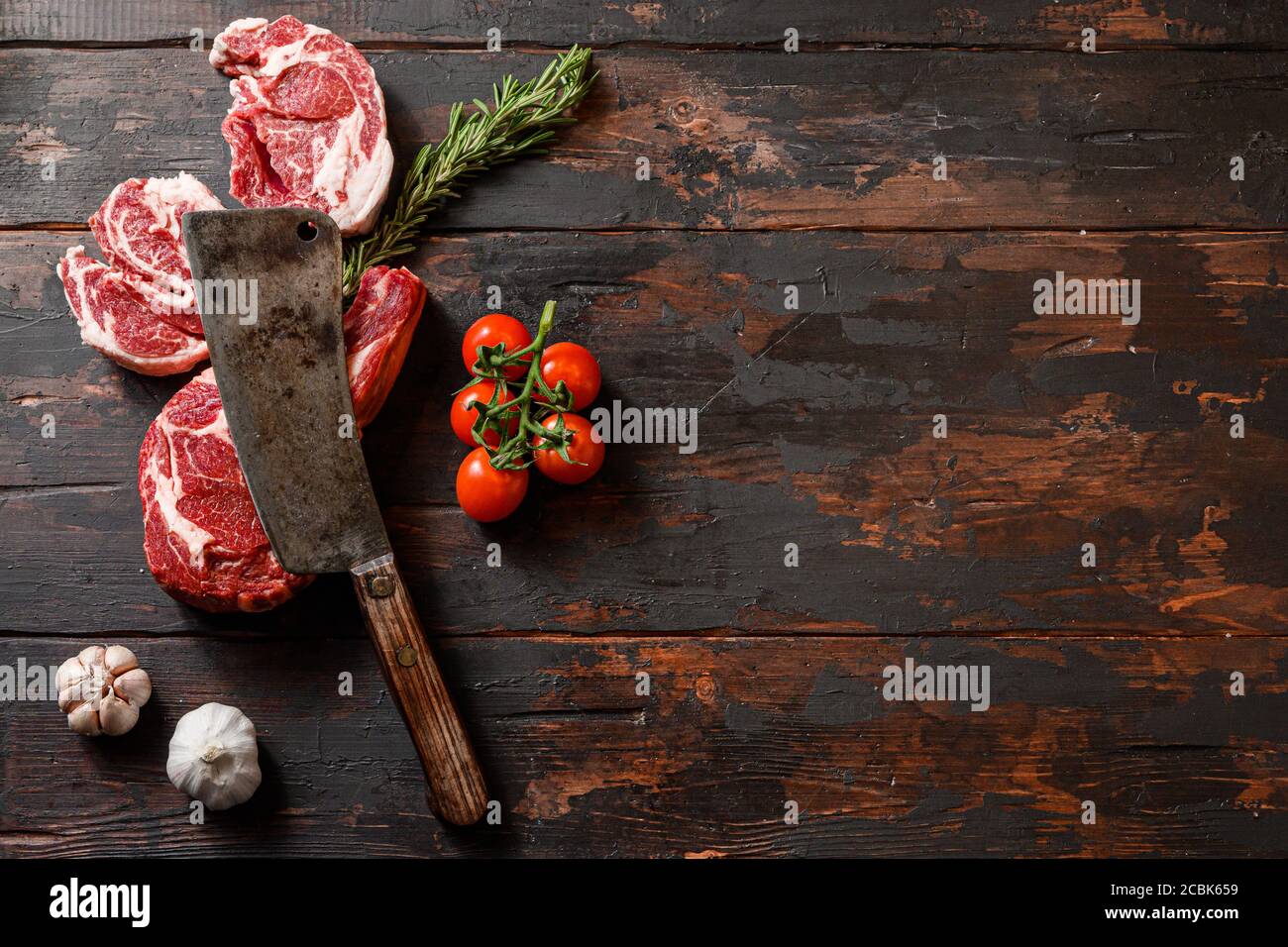 Raw uncooked black angus beef tomahawk or Cowboy steak and Chuck ...