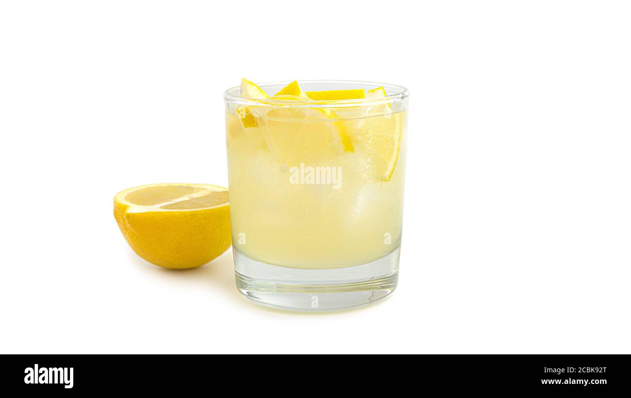 Glass with lemon lemonade and ice on a white background Stock Photo - Alamy