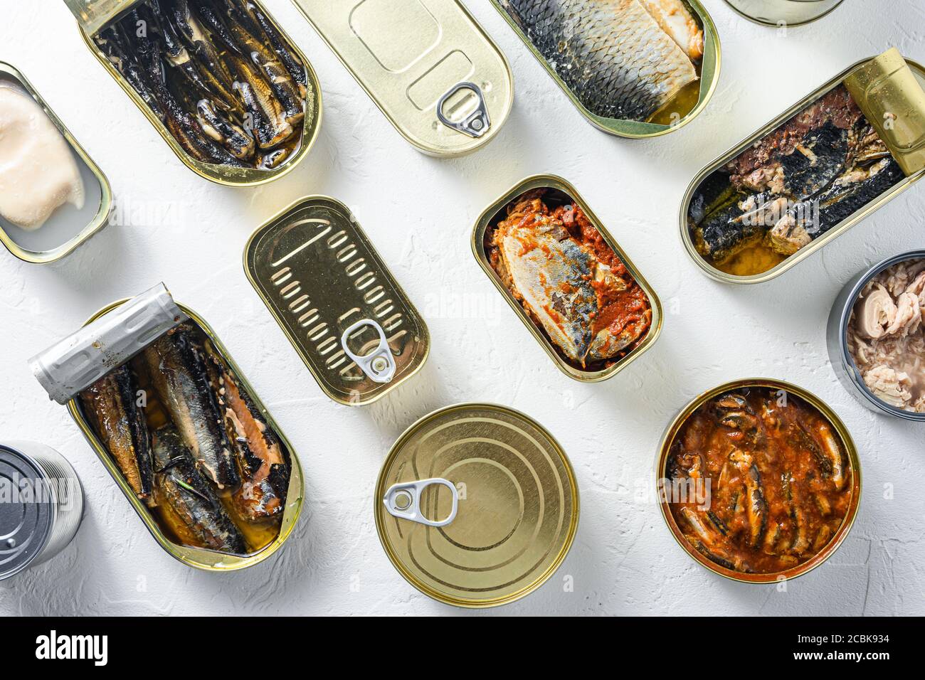 opened cans with different types of fish and seafood, opened and closed ...