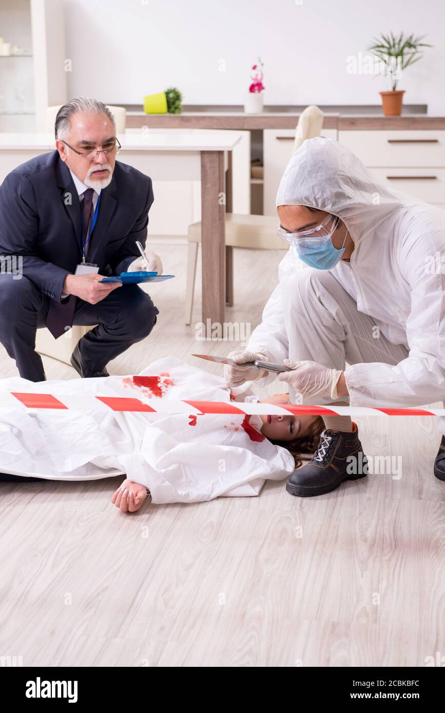 Forensic experts at the crime scene at home Stock Photo - Alamy