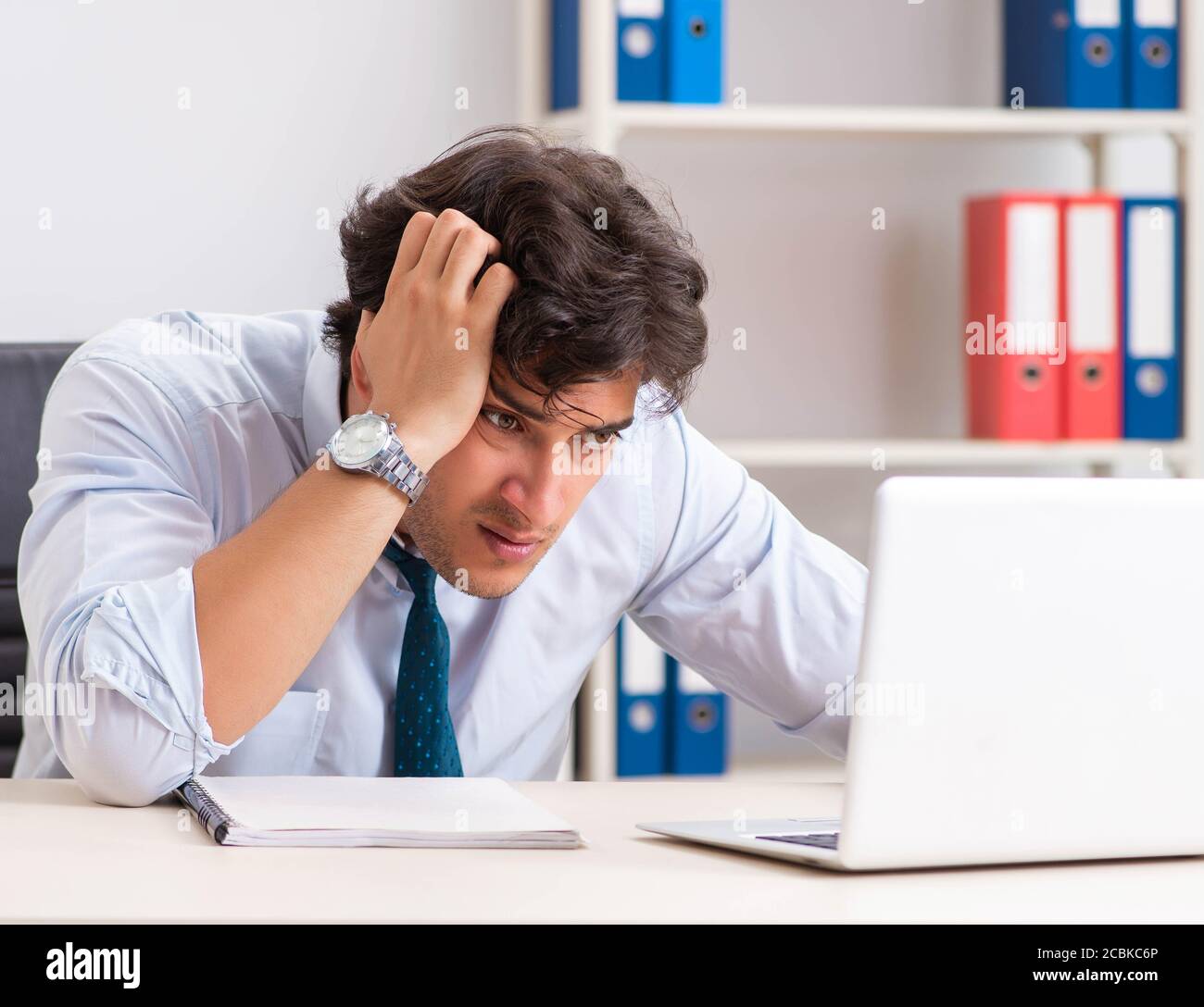 The overloaded busy employee with too much work and paperwork Stock ...