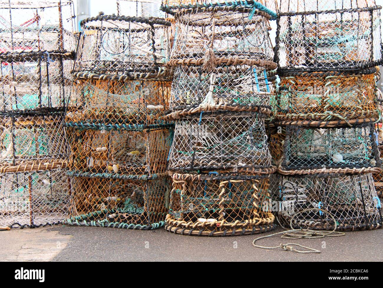 A Stack of Fishing Pots on a Harbour Quayside Stock Photo - Alamy
