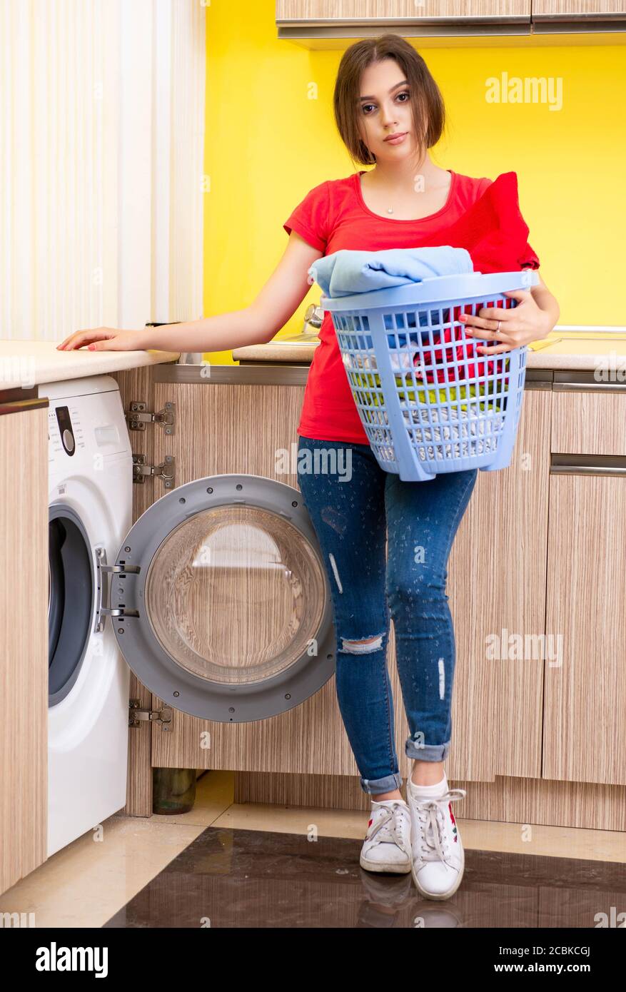 The woman doing laundry at home Stock Photo - Alamy
