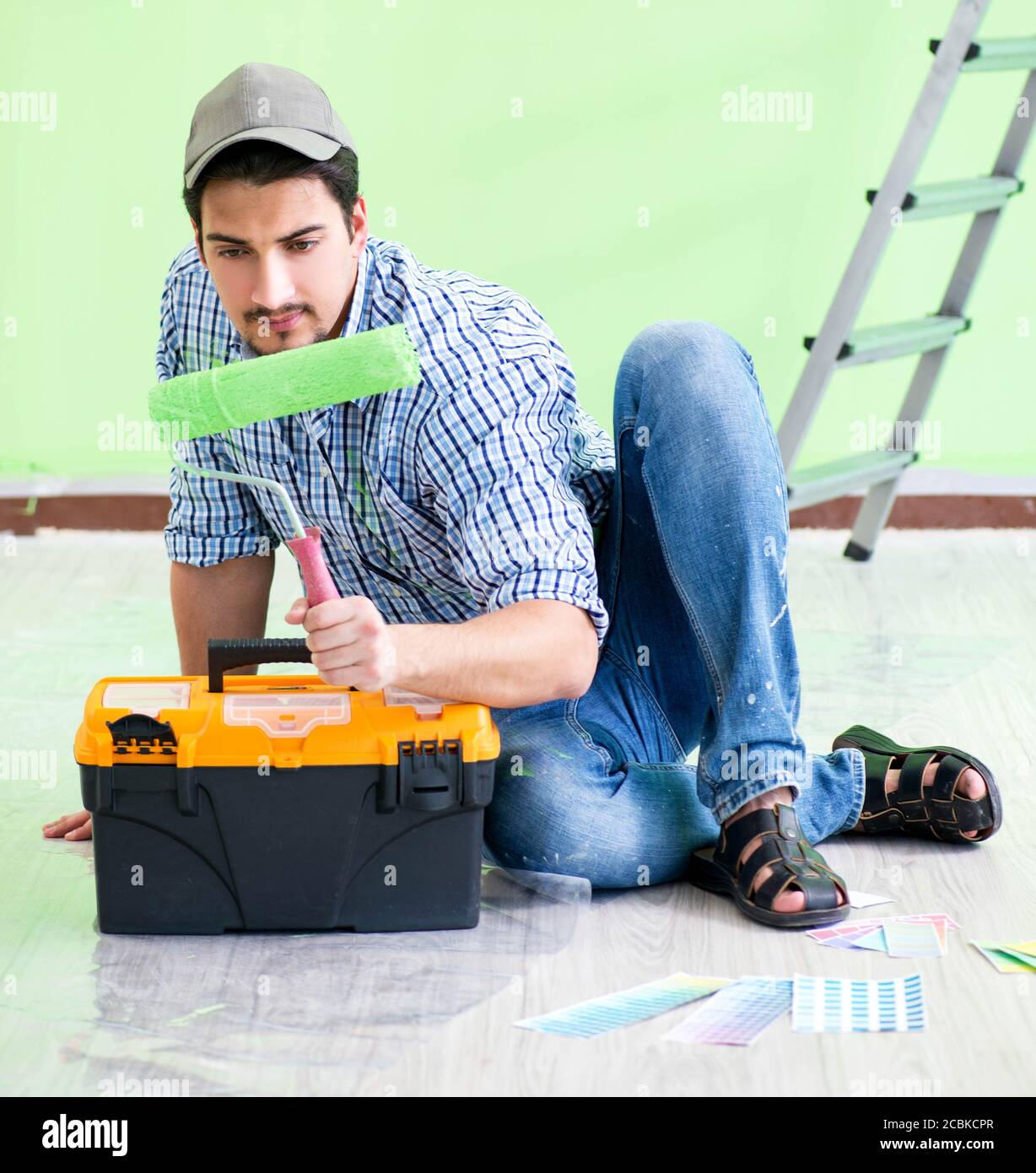 The young man doing home renovation Stock Photo - Alamy