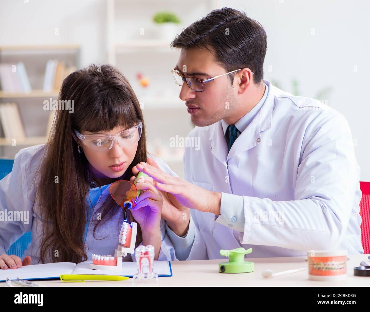 The doctor explaining to assistant how to use ultraviolet gun Stock ...