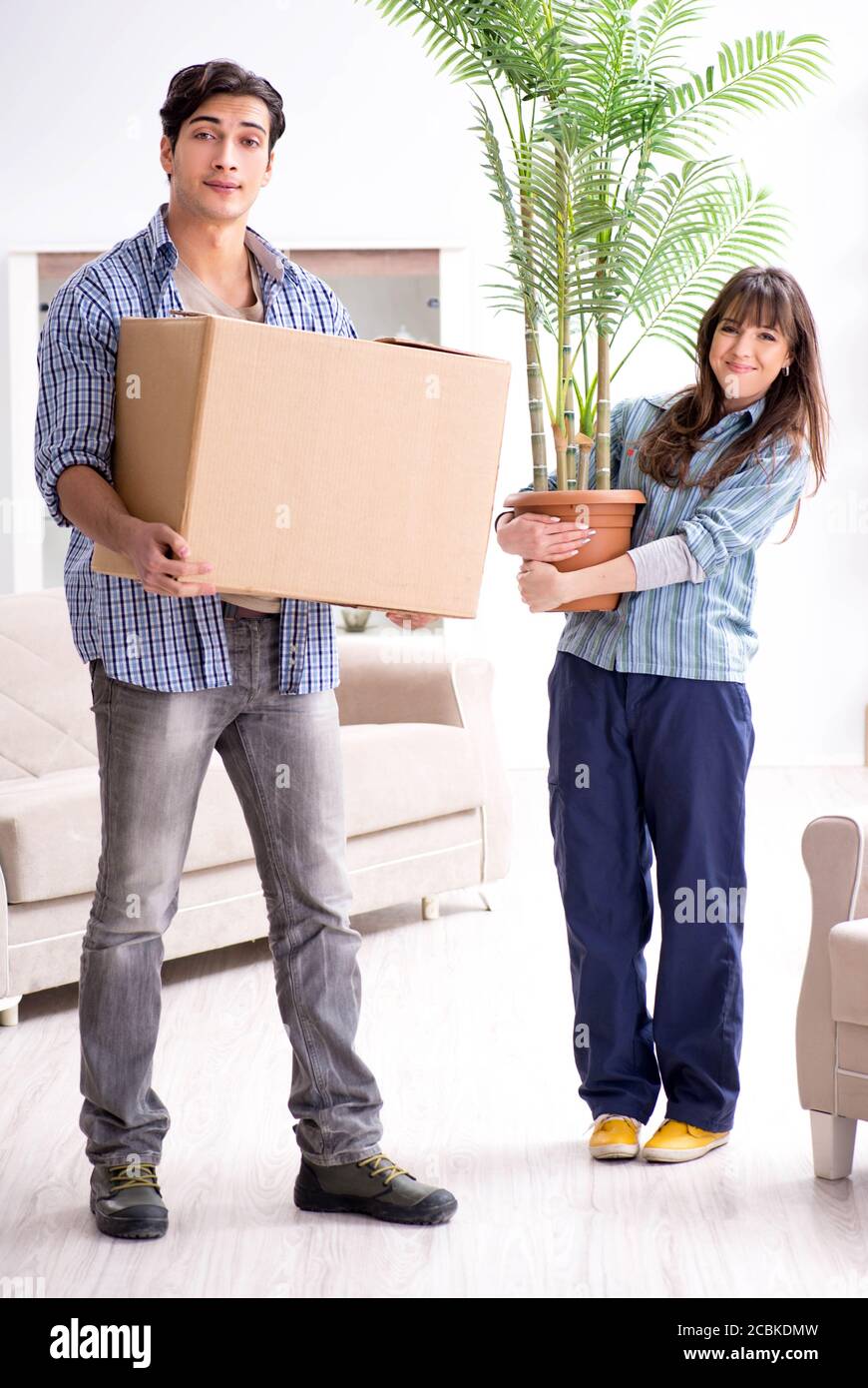 Young family moving in to new apartment after paying off mortgage Stock ...