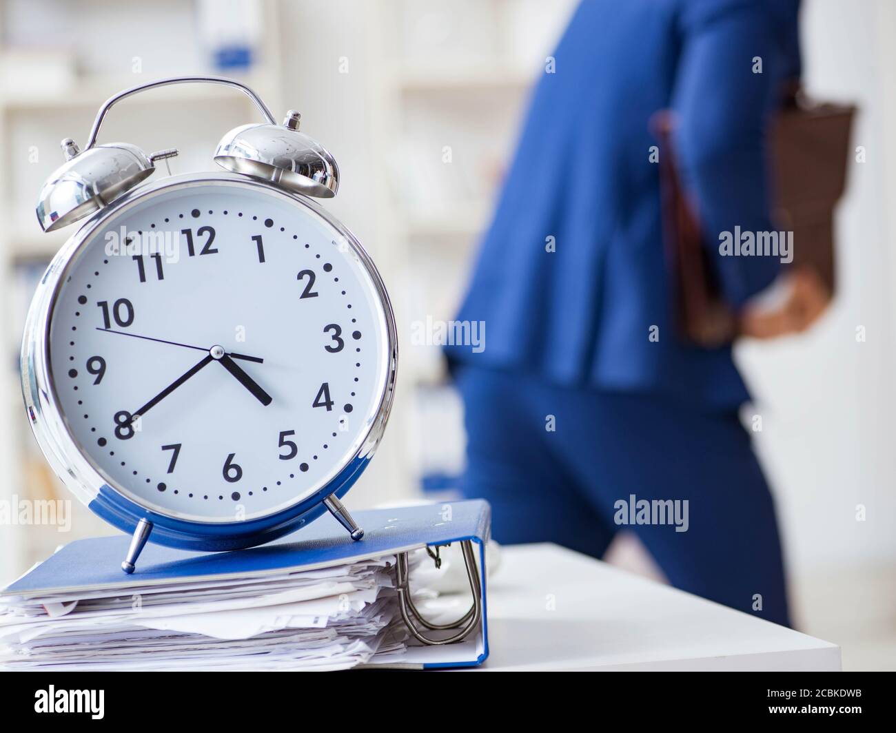 The businessman in bad time management concept Stock Photo - Alamy