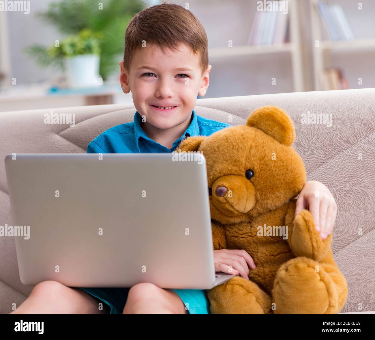 The little boy surfing internet on laptop Stock Photo - Alamy