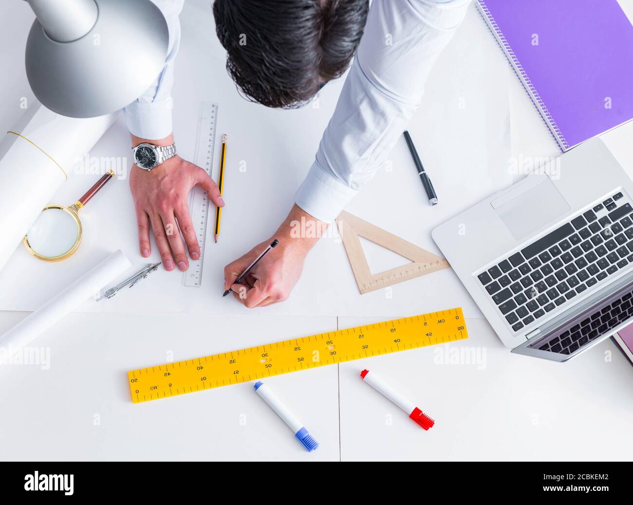 The engineer working on new project drawings Stock Photo - Alamy