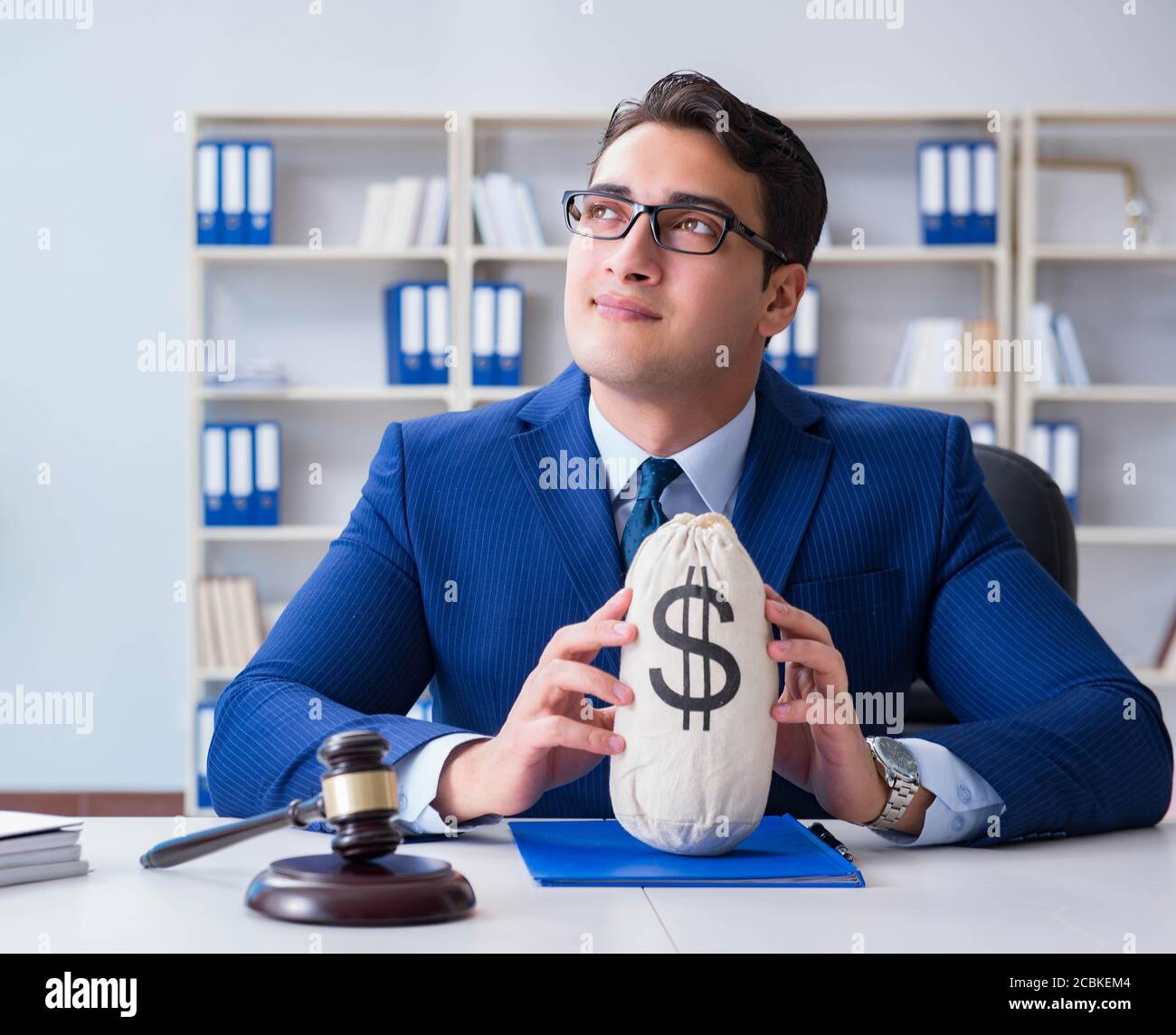The judge in bribe concept with money Stock Photo - Alamy