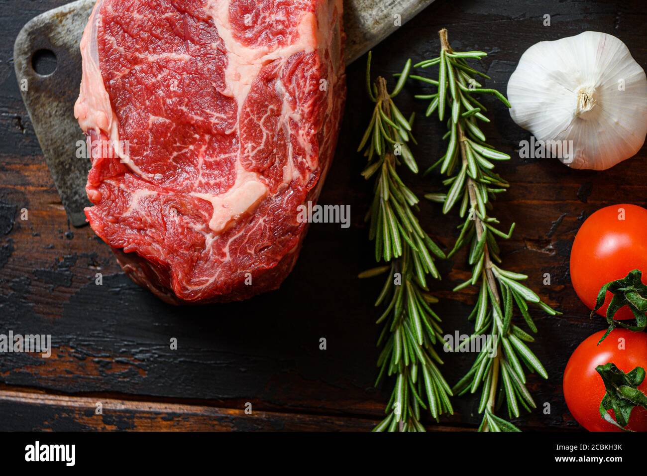 Fresh tomahawk steak on meat cleaver. Organic farm marbled prime black ...