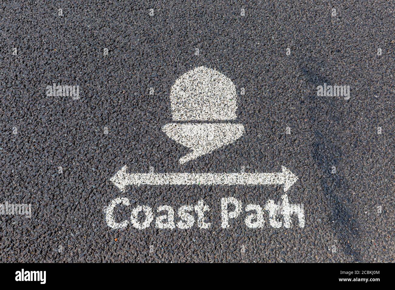 The England Coast Path sign painted onto the tarmac at Dungeness Point ...