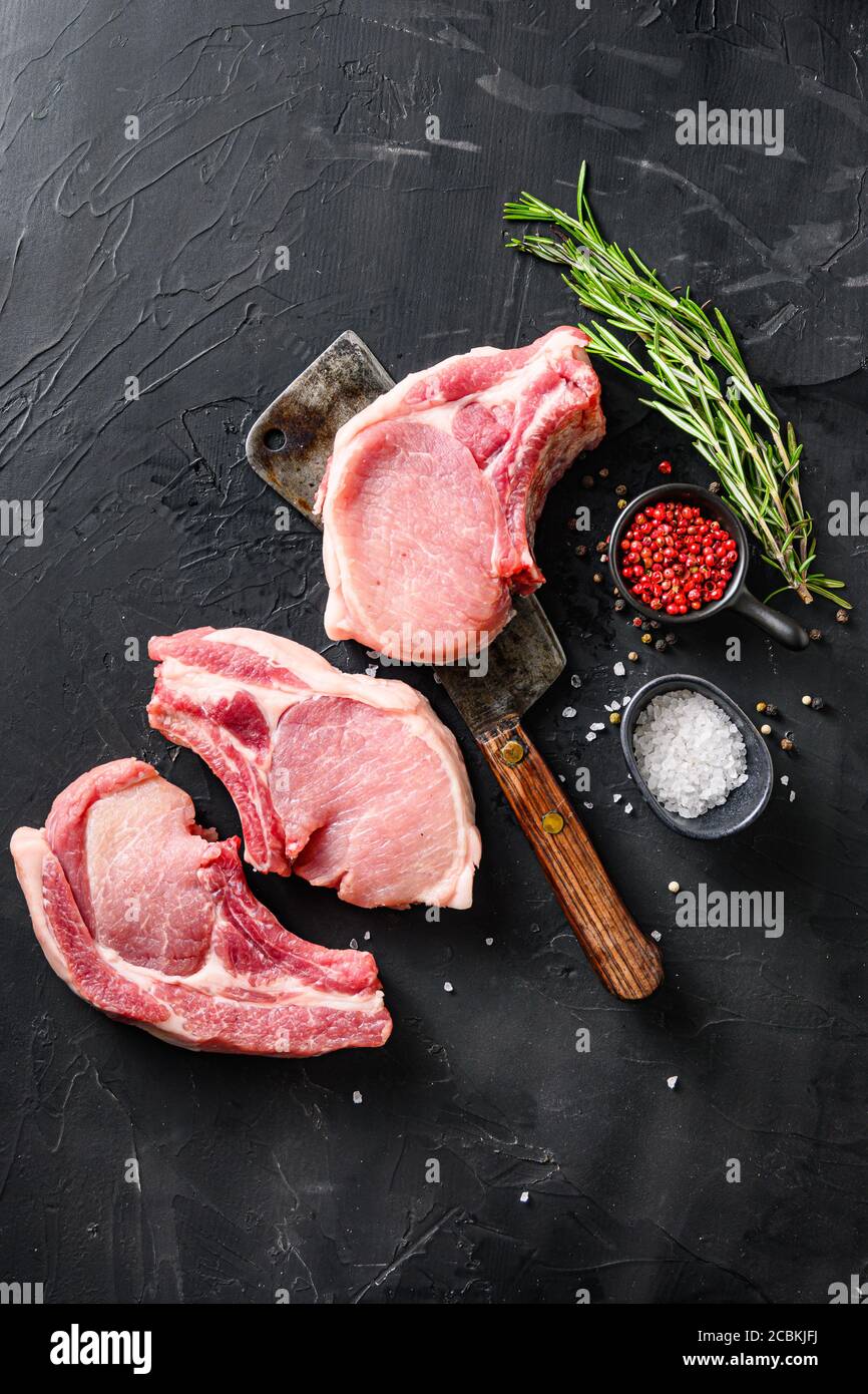 Organic Pork meat chop over american classic butcher knife or cleaver ...