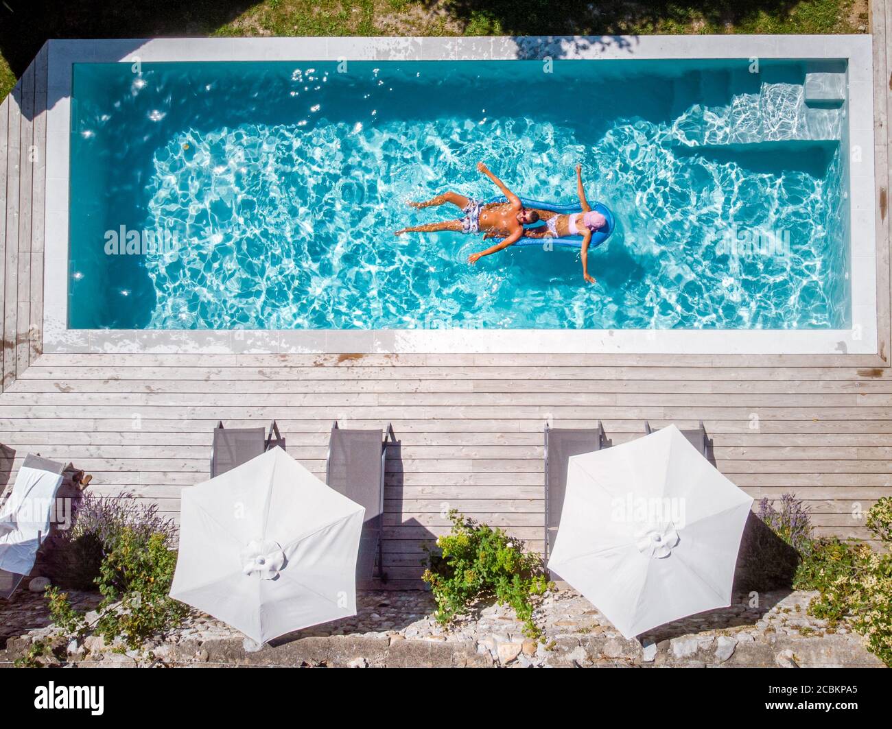 two person swim in the pool at the hotel. View from above, couple men ...