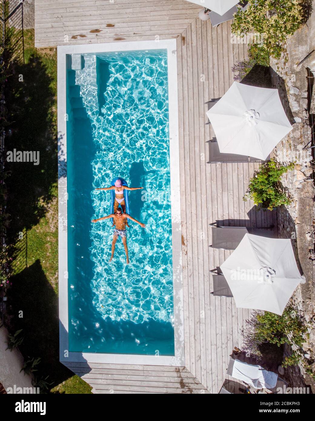 two person swim in the pool at the hotel. View from above, couple men ...