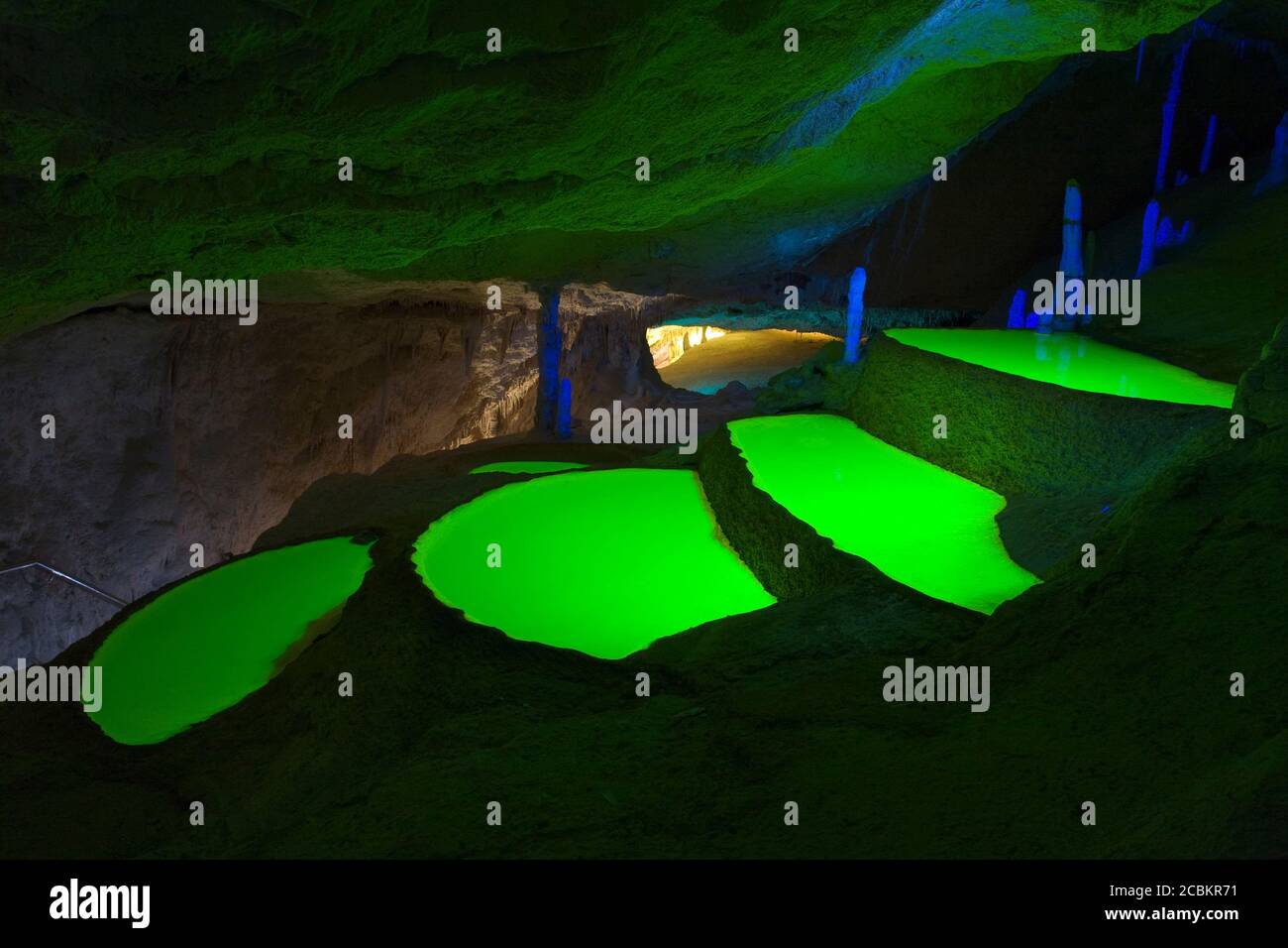 Illuminated pools in cave Stock Photo - Alamy