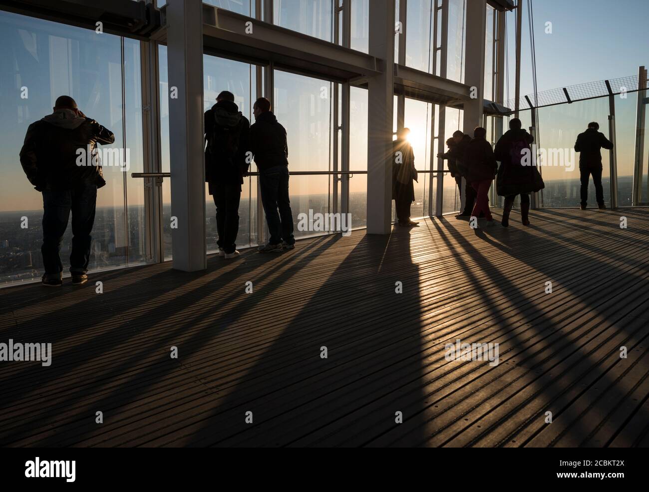 Group of tourists photographing from skyscraper rooftop, London, UK ...