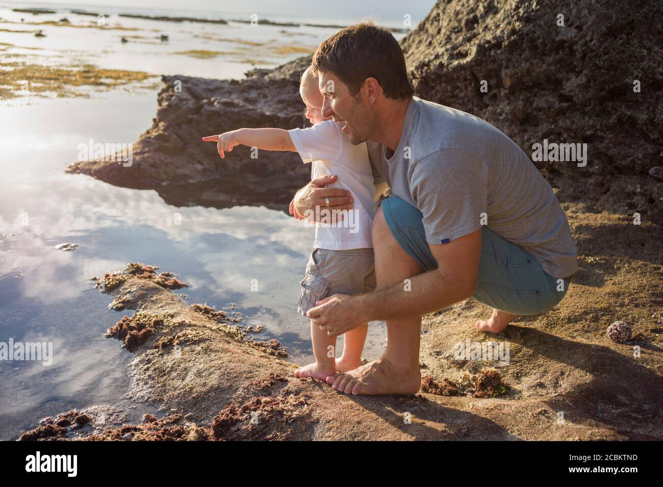 Man pointing out out sea hi-res stock photography and images - Alamy