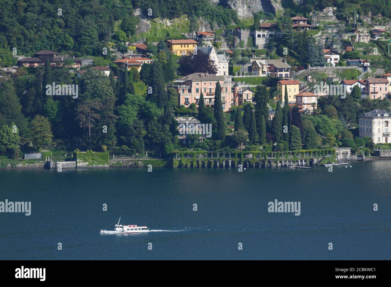 Elevated view of ferry and the village of Laglio village, Lake Como ...