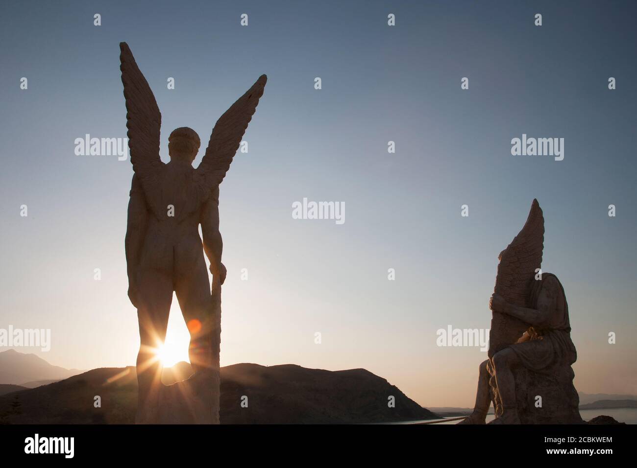 Agia Galini, statue of Icarus and Daedalus at sunset, Crete, Greece ...