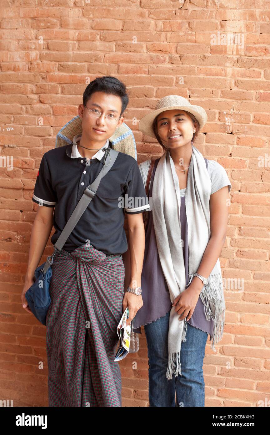 Portrait of young couple by brick wall, Bagan, Burma Stock Photo - Alamy
