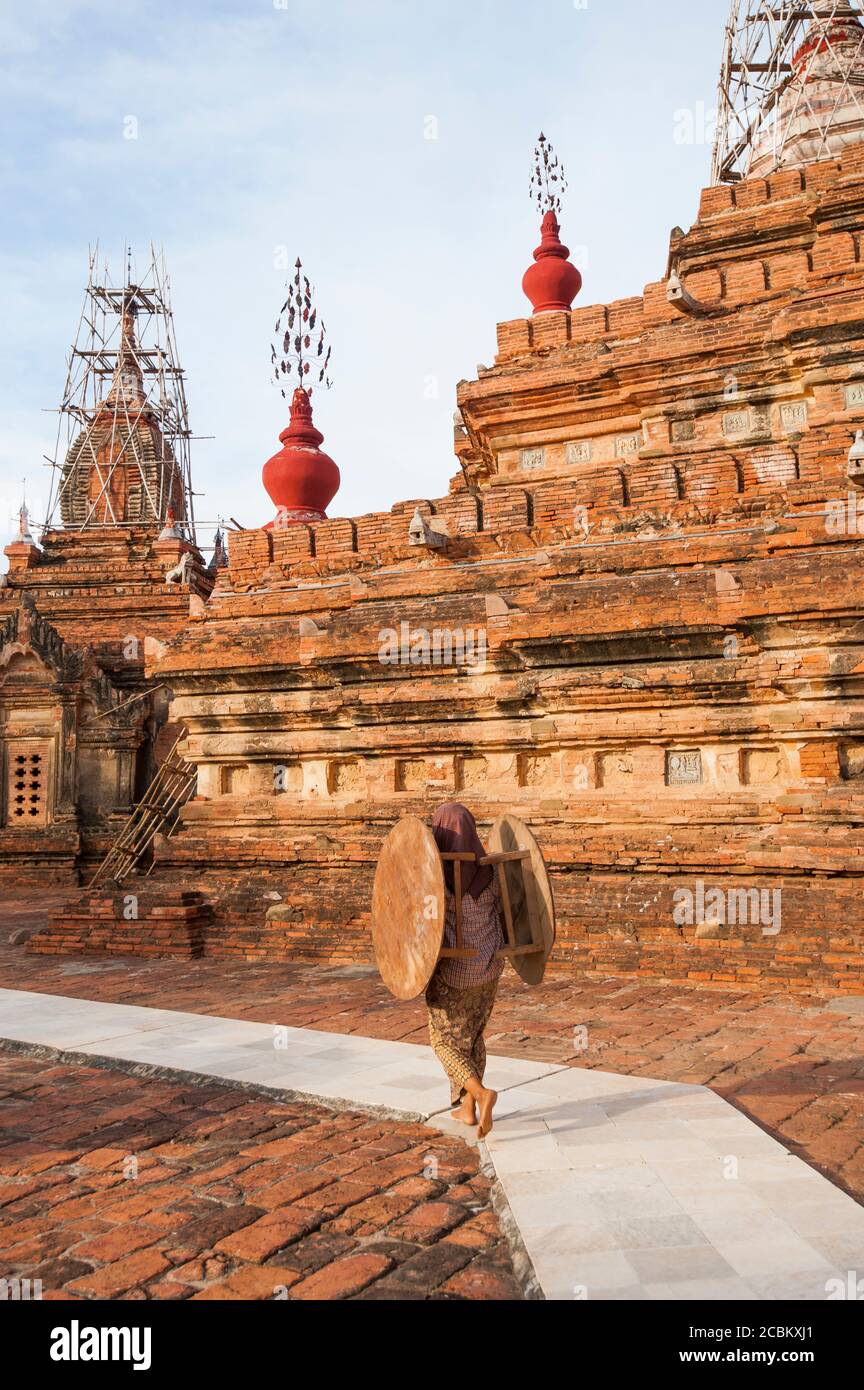 Person carrying tables, Bagan, Myanmar Stock Photo - Alamy