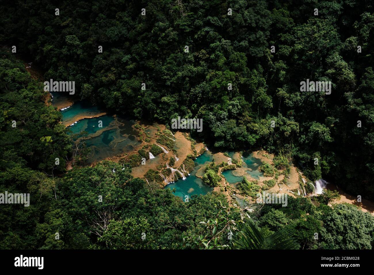 Aerial view of turquoise waterfalls in jungle, Semuc Champey, Alta ...