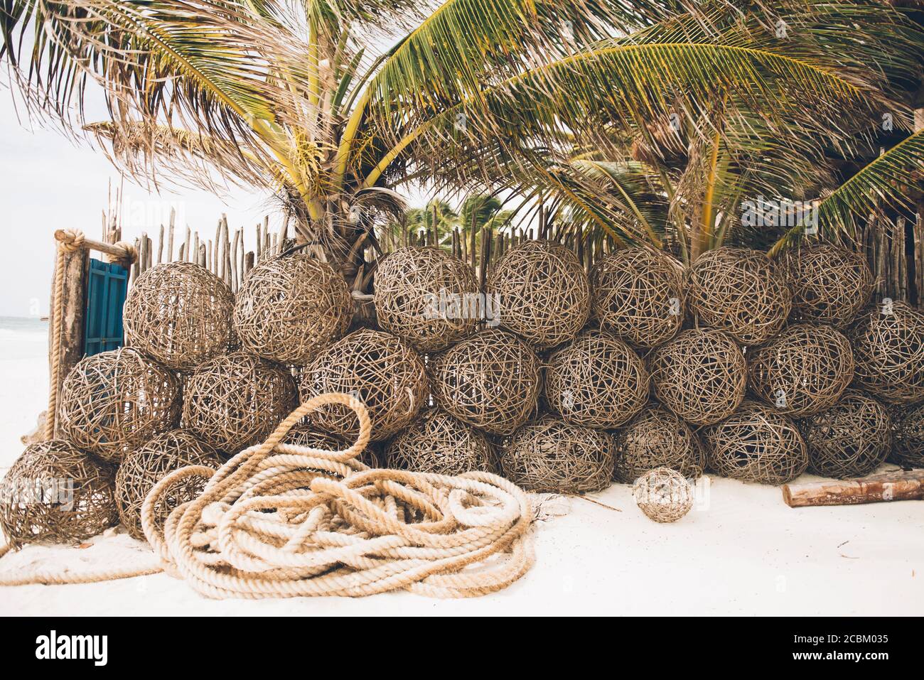 Woven baskets and rope on beach, Tulum, Mexico Stock Photo - Alamy
