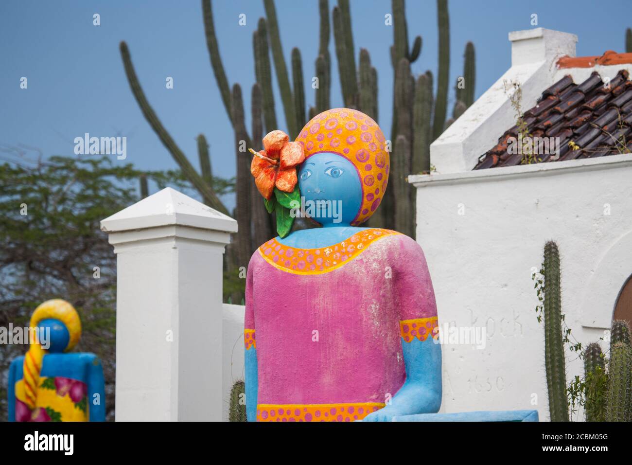Multi colored sculptures of women, St. Willibrordus, Curacao, Caribbean ...