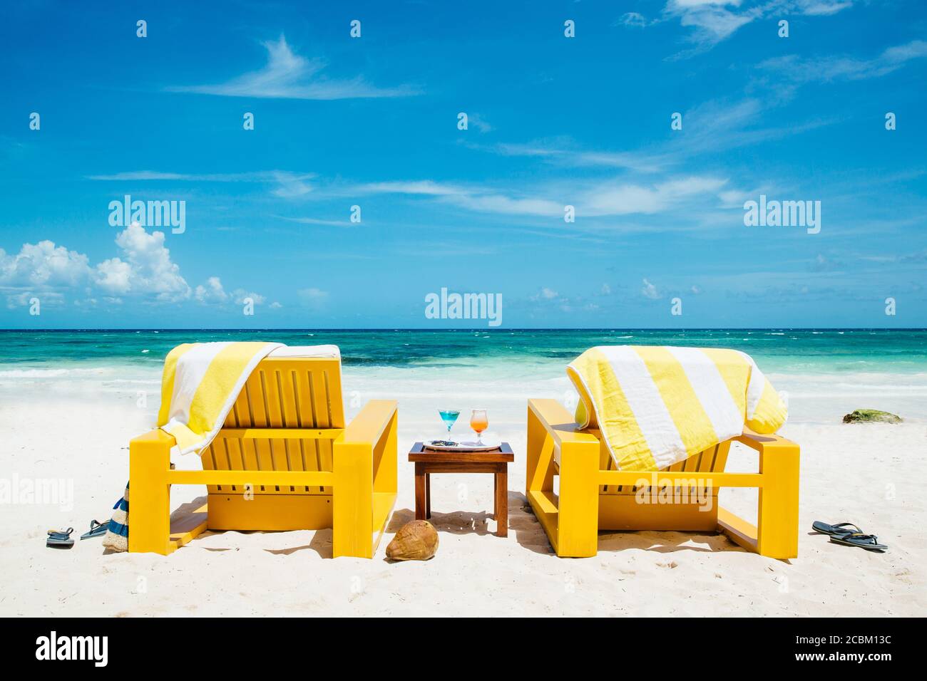 Two yellow sun loungers on hotel beach, Tulum, Riviera Maya, Mexico ...